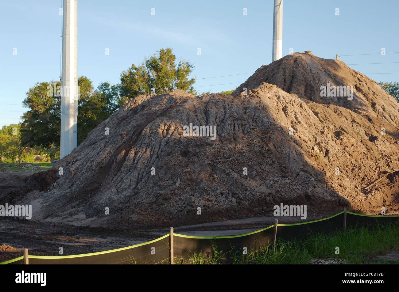 Wide view near sunset large dirt pile on the right of Electric ...
