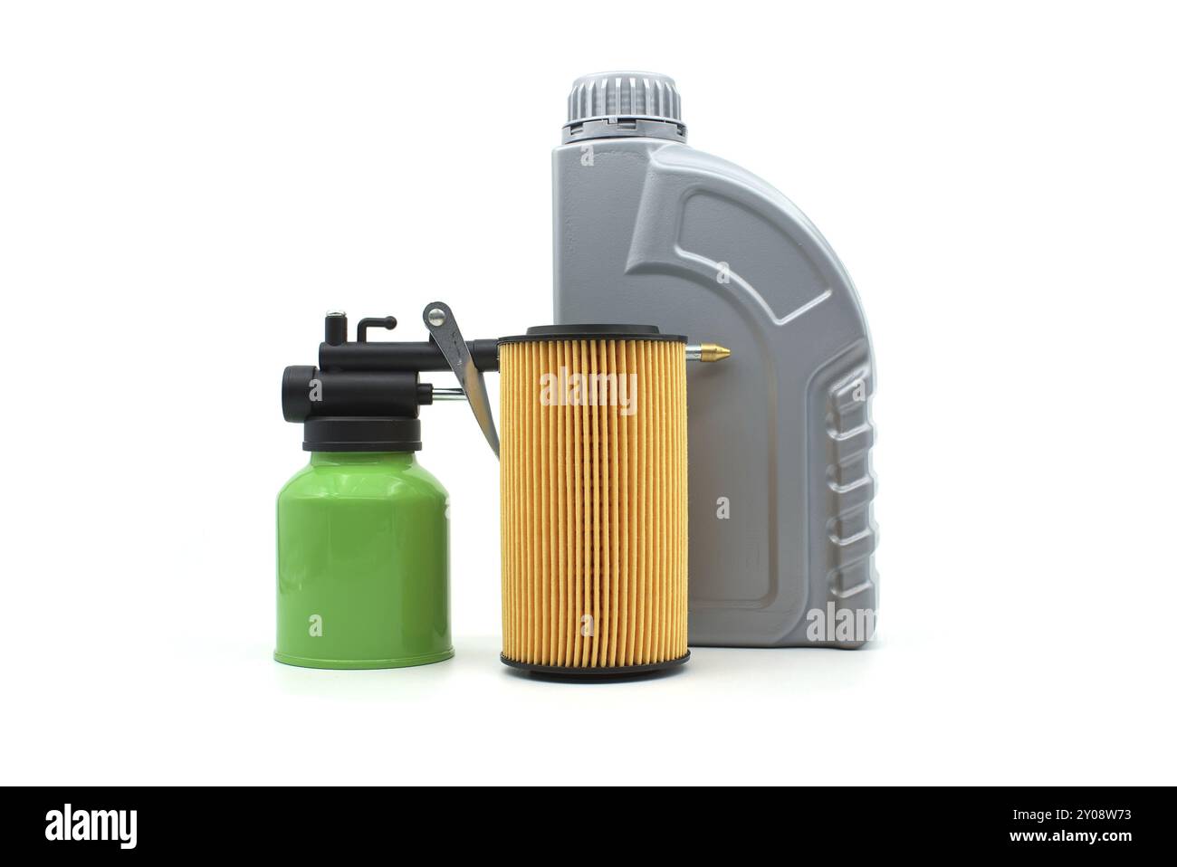 Vehicle engine oil filters and hand pump oiler isolated on a white ...