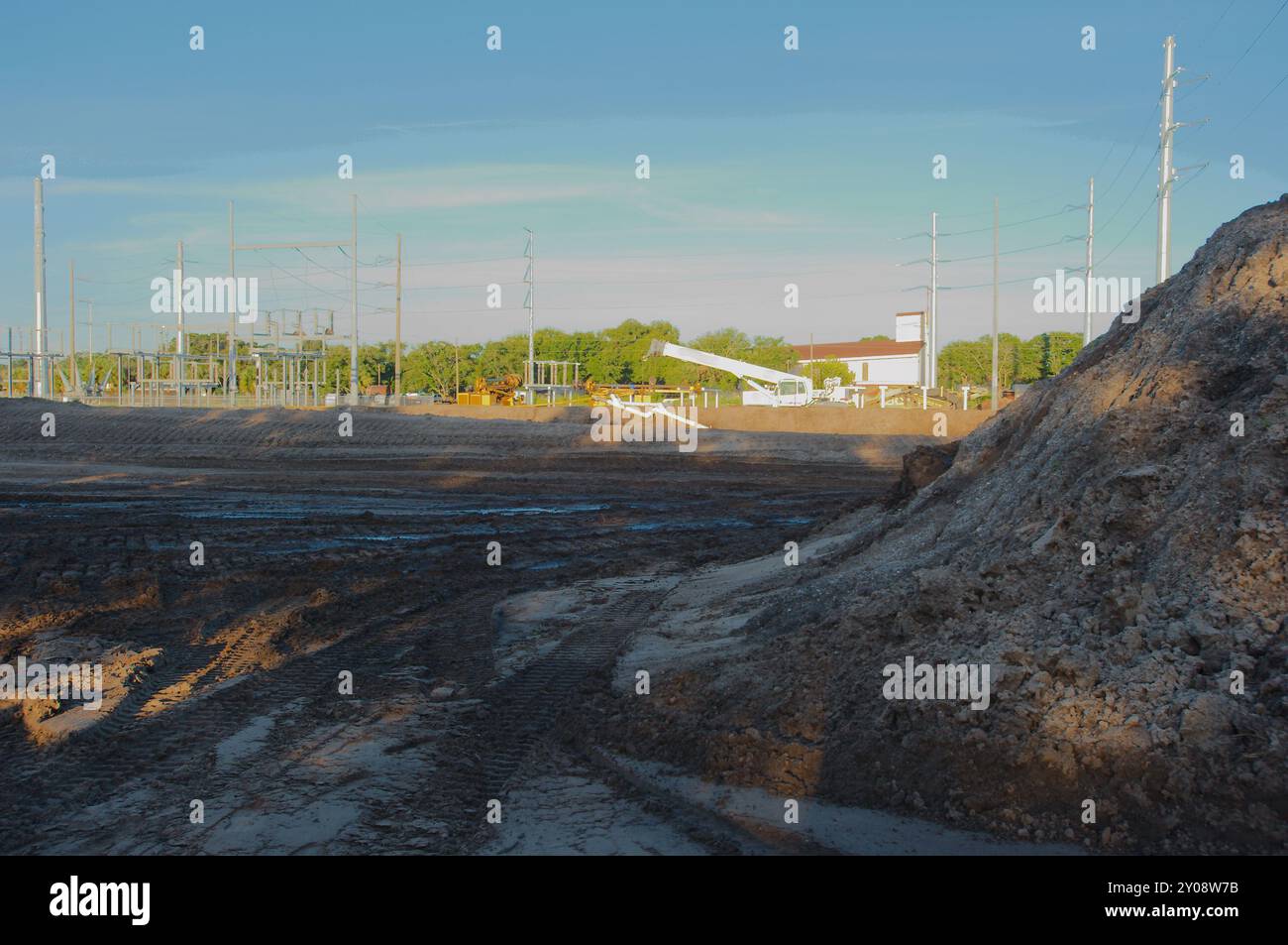 Wide view near sunset large dirt pile on the right of Electric ...
