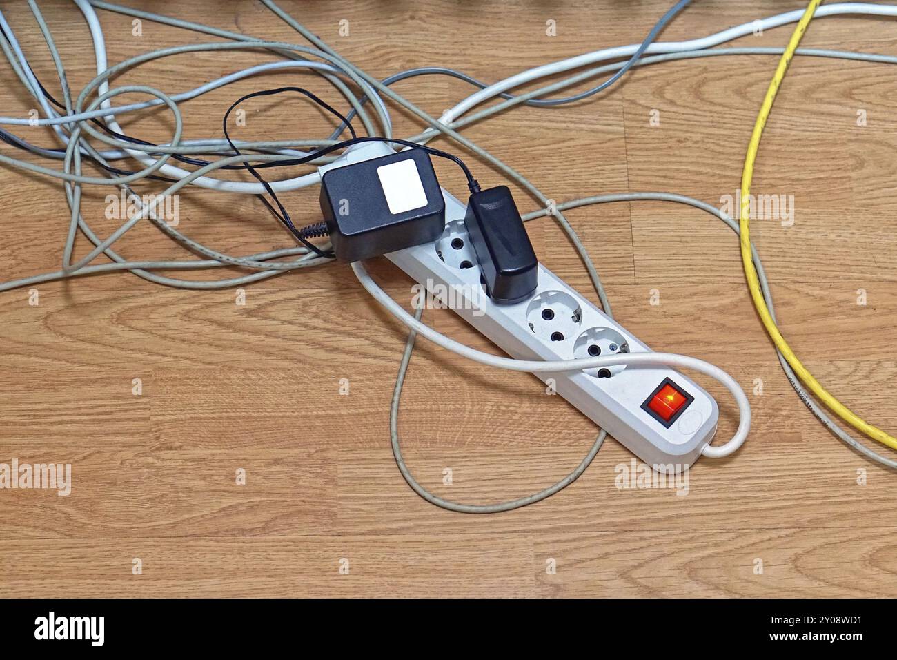 Electric power strip with illuminated switch in Europe Stock Photo - Alamy