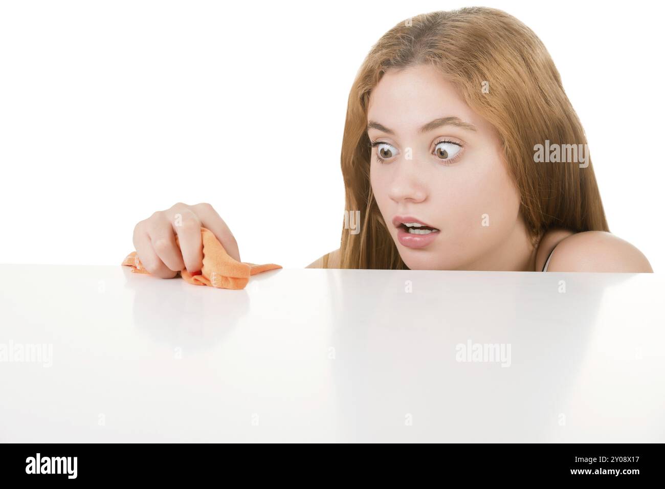 Woman in panic trying to clean germs from her desk, isolated in white ...