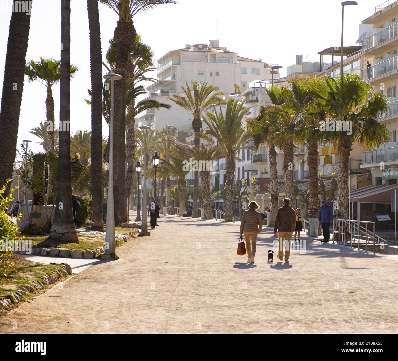 Beach promenade with strollers in Sitges, Spain, Europe Stock Photo - Alamy