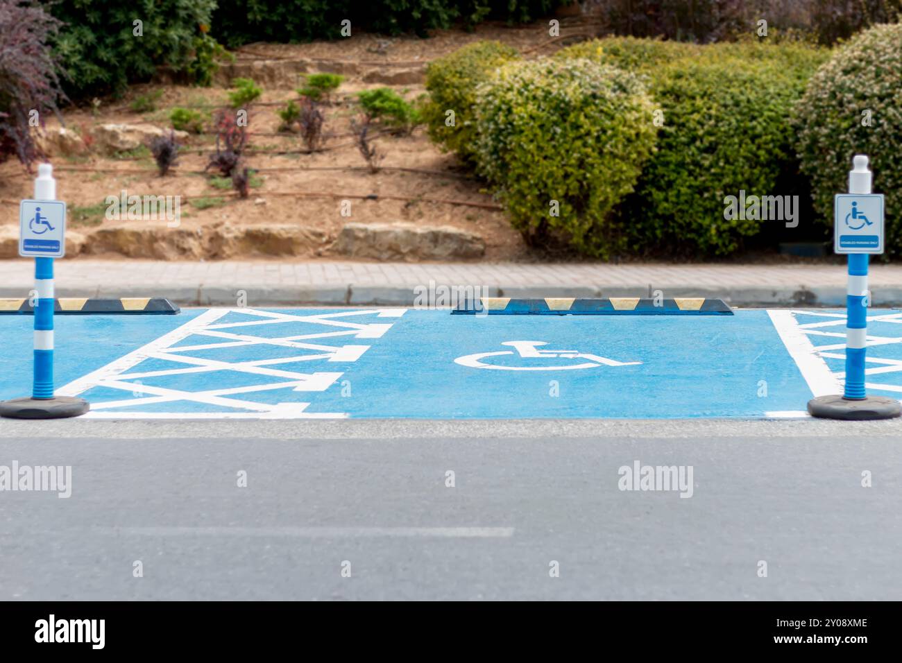 Disabled parking sign and spot on the street Stock Photo - Alamy