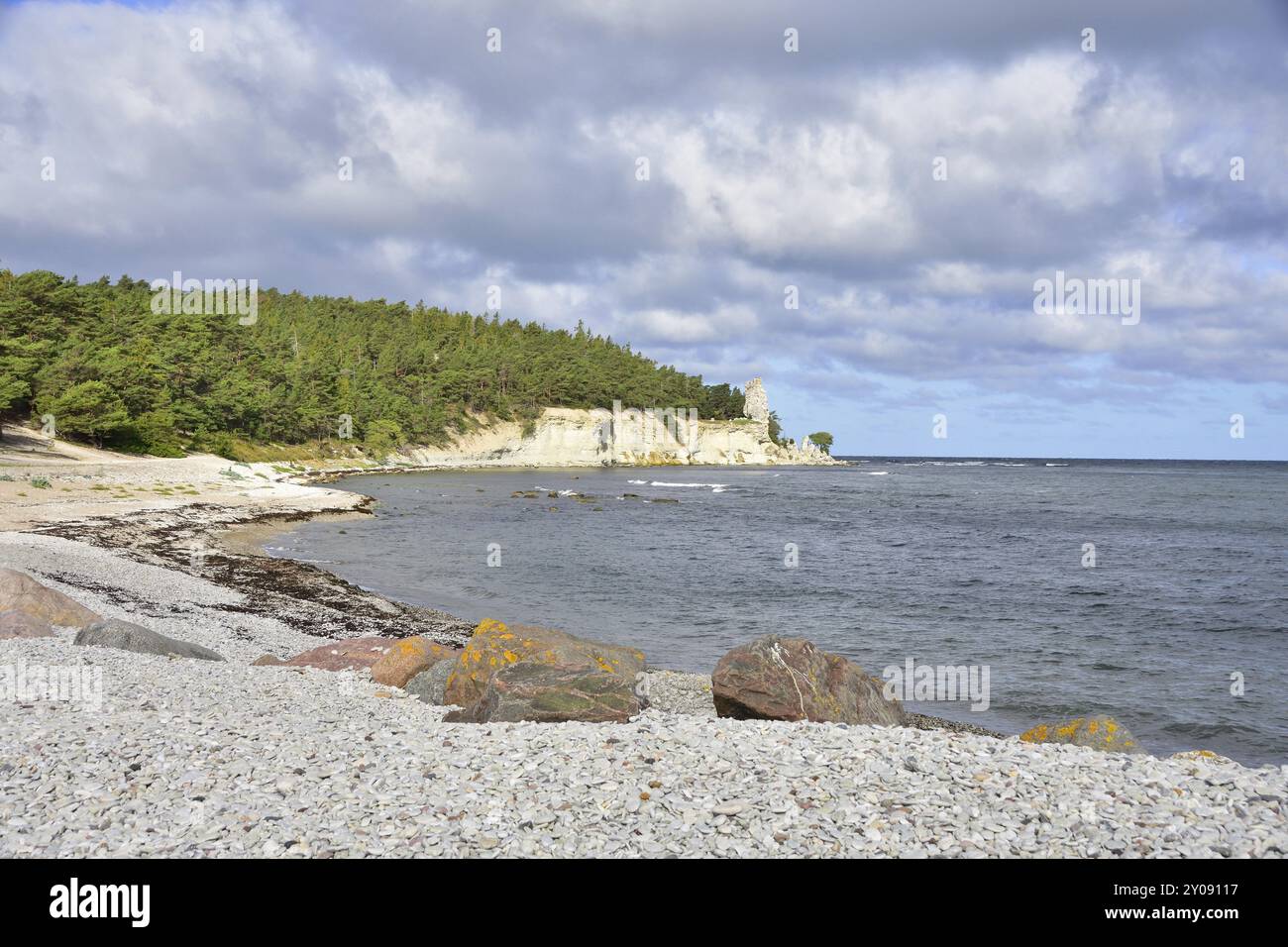 Lickershamn with the Jungfrau rauk rock. Gotland's largest rauk the ...