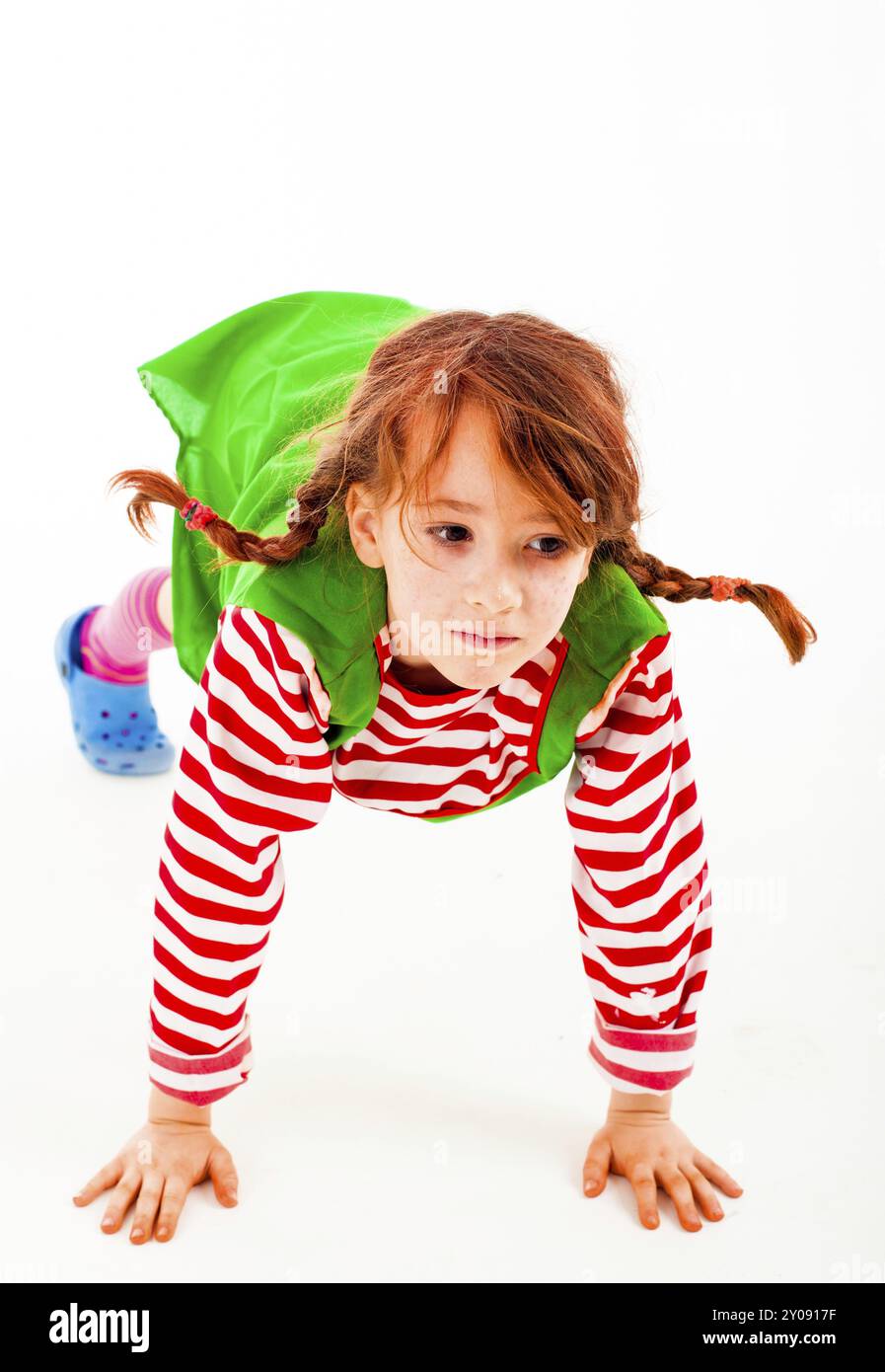 Little girl dressed as Pippi Longstocking with white background Stock ...