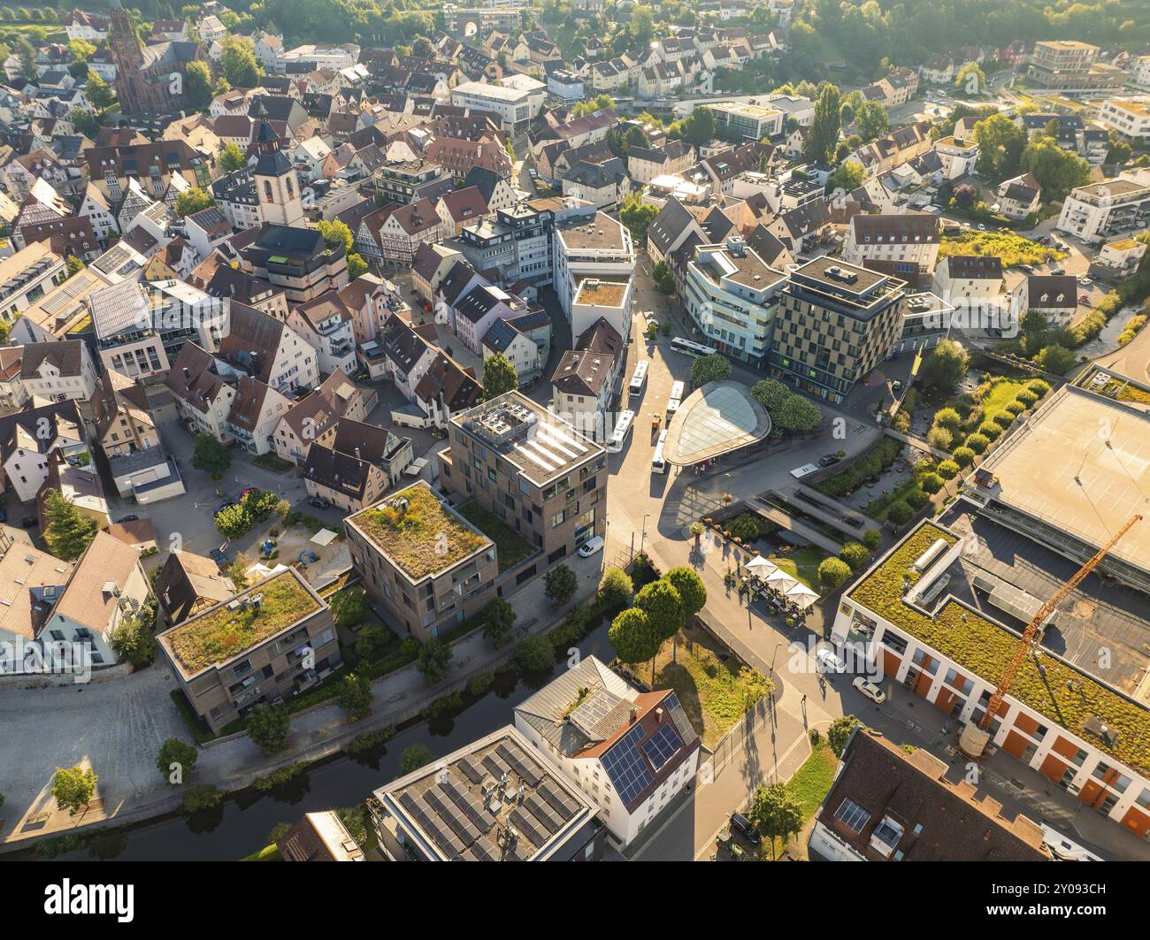 Aerial view of a town with densely built-up houses, streets and public ...