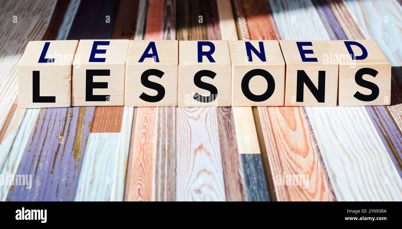 Lessons learned text on wooden blocks on a beautiful background ...
