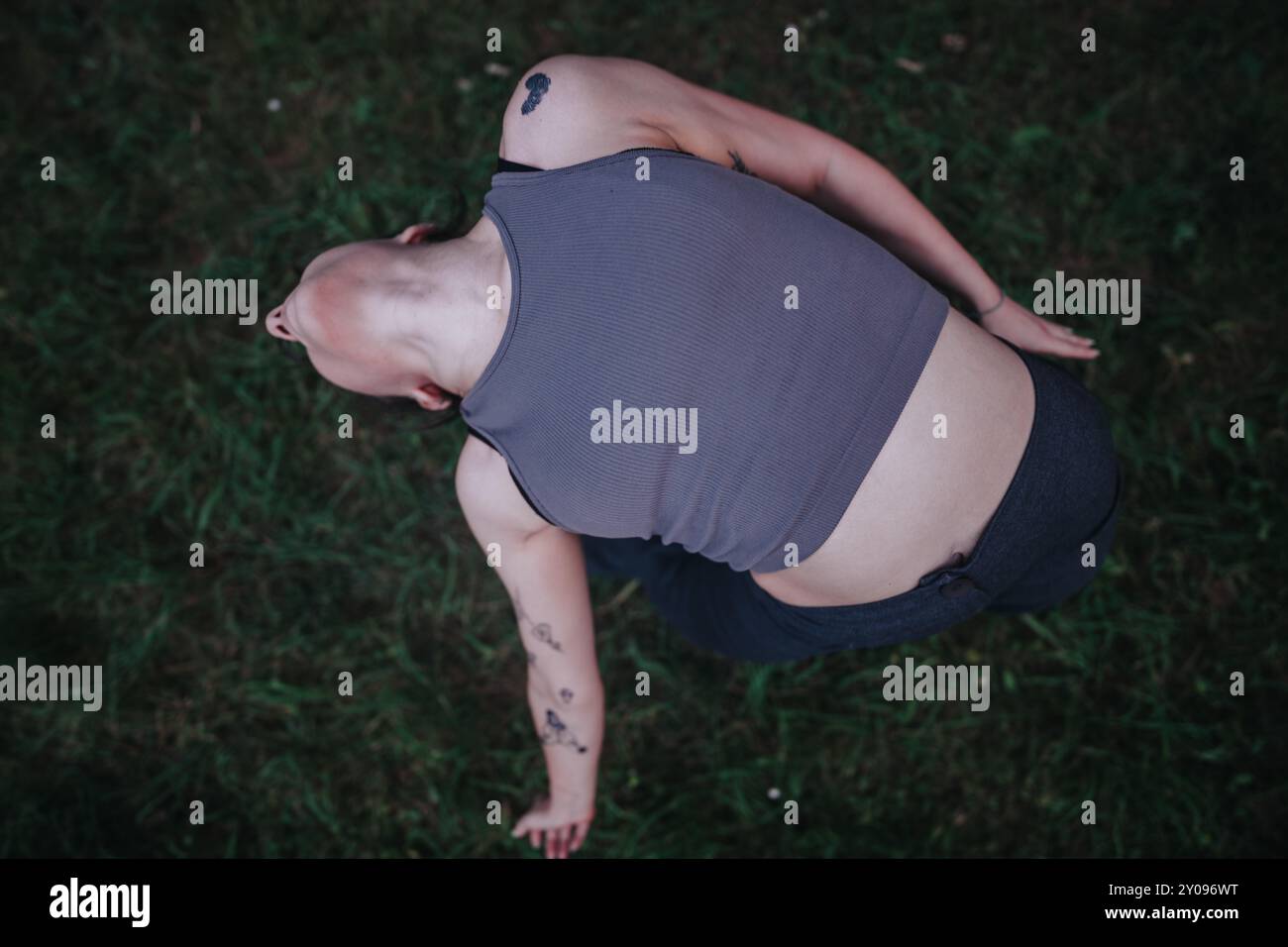 Young girl dancing in the park showcasing grace and movement, top view ...