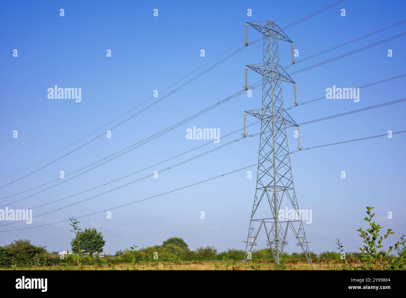 A high voltage electric power transmission tower amidst open ...