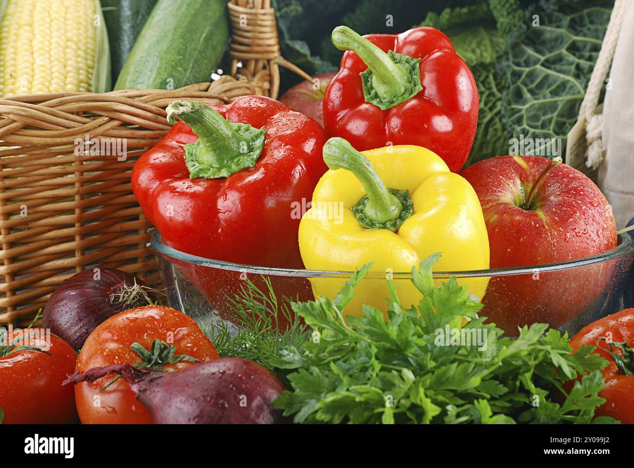 Composition with raw vegetables and wicker basket Stock Photo - Alamy