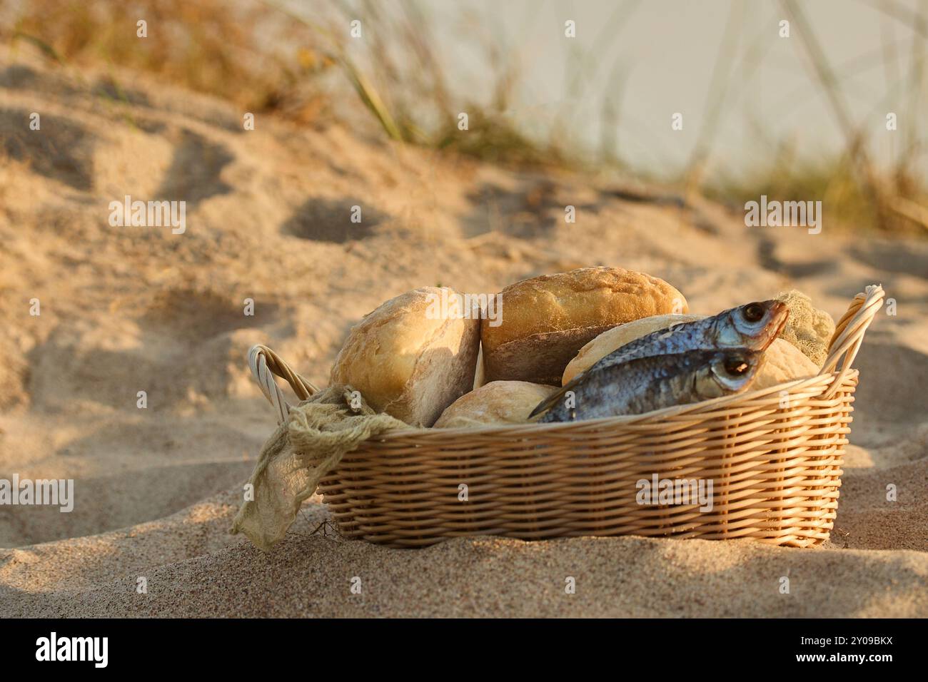 Five loaves of bread and two fish hi-res stock photography and images ...
