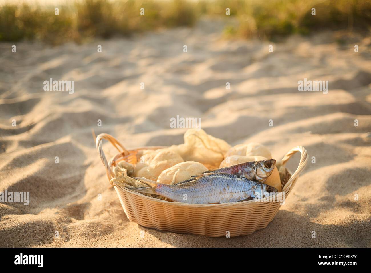 Five loaves of bread and two fish hi-res stock photography and images ...