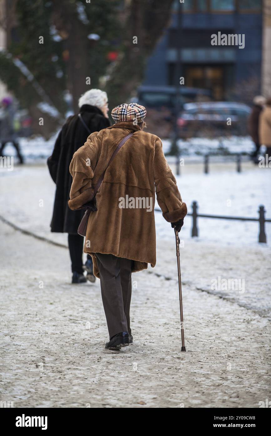 Two old ladies in fur coats and with walking sticks Stock Photo - Alamy