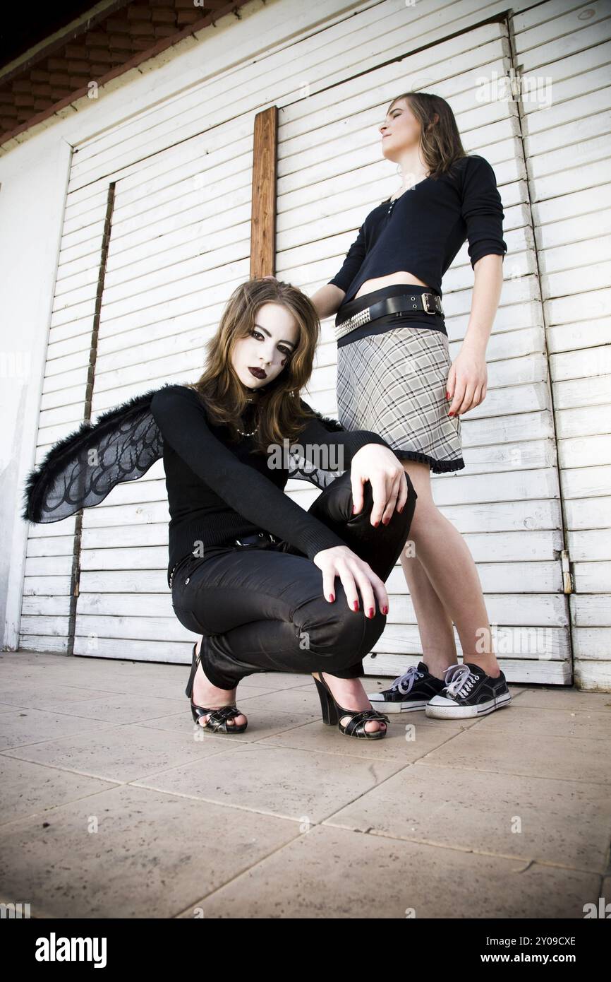 Modern Style Teenagers Against Wooden Door Stock Photo - Alamy