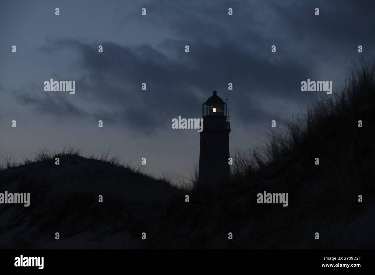 The light of a lighthouse shines in the darkness Stock Photo - Alamy