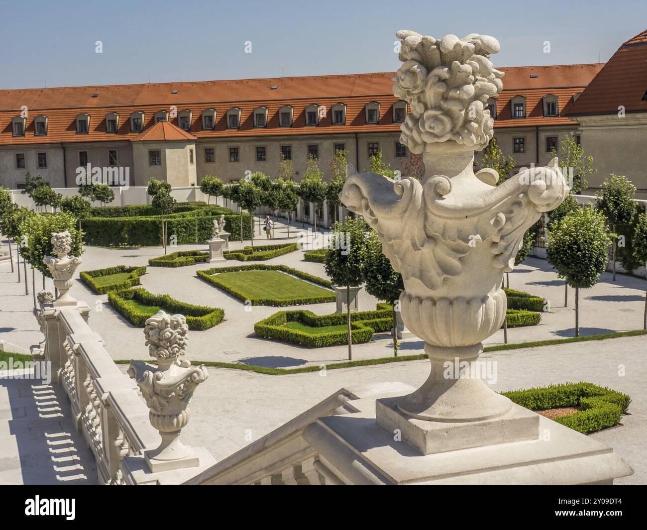 View of well-tended gardens with baroque pot sculptures and historical ...