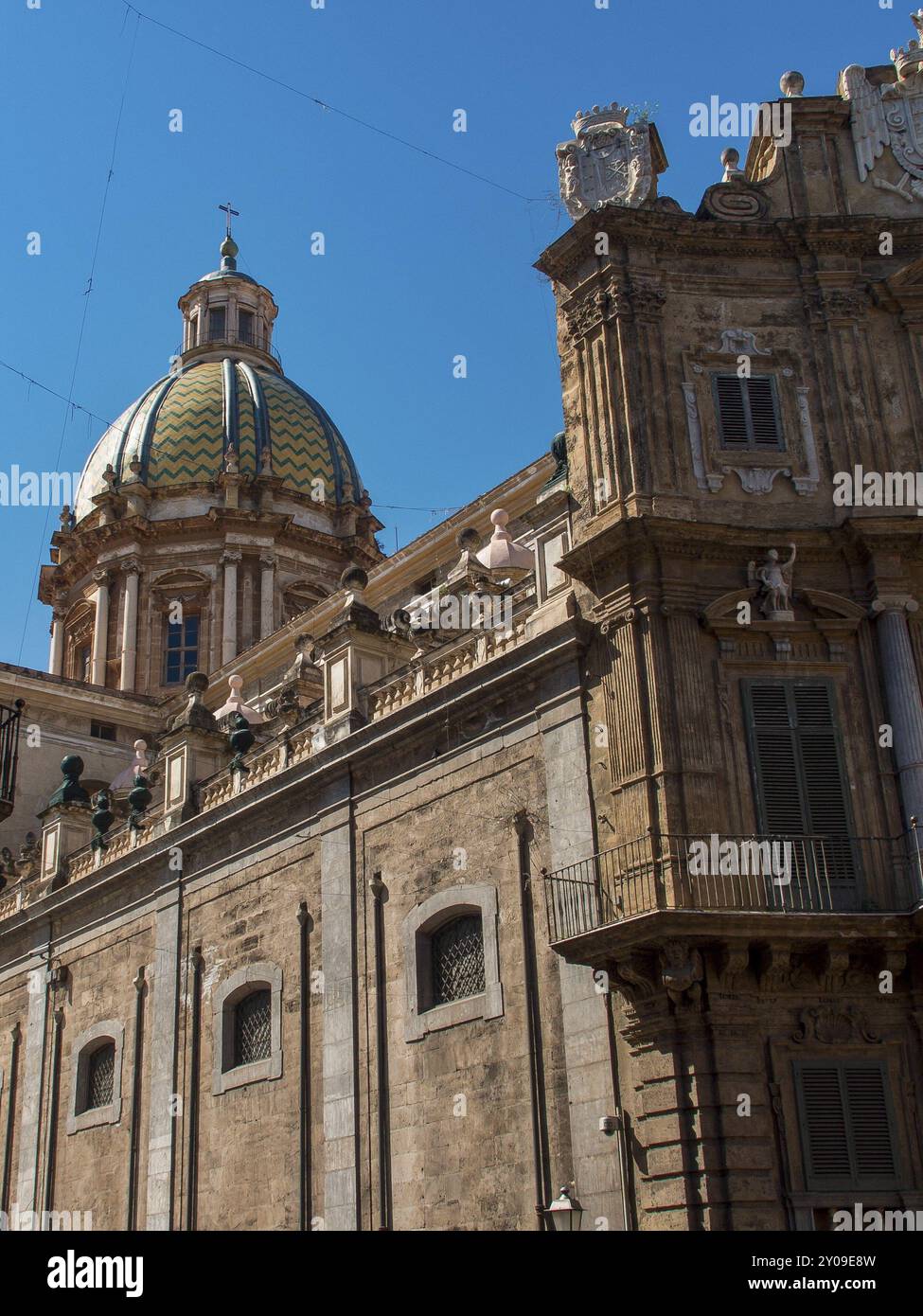 Baroque building with a striking dome, stone walls and windows under a ...