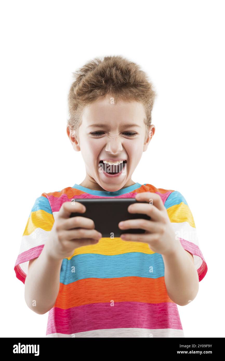 Little smiling child boy playing games or surfing internet on digital ...
