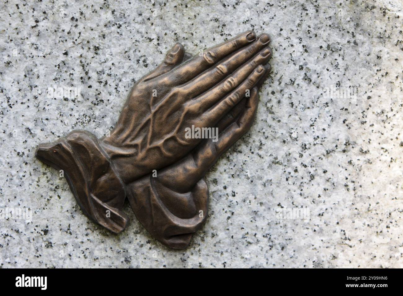 Praying hands a tombstone hi-res stock photography and images - Alamy