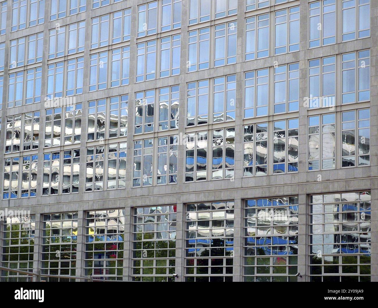 Blue glass facade reflecting the buildings opposite Stock Photo - Alamy