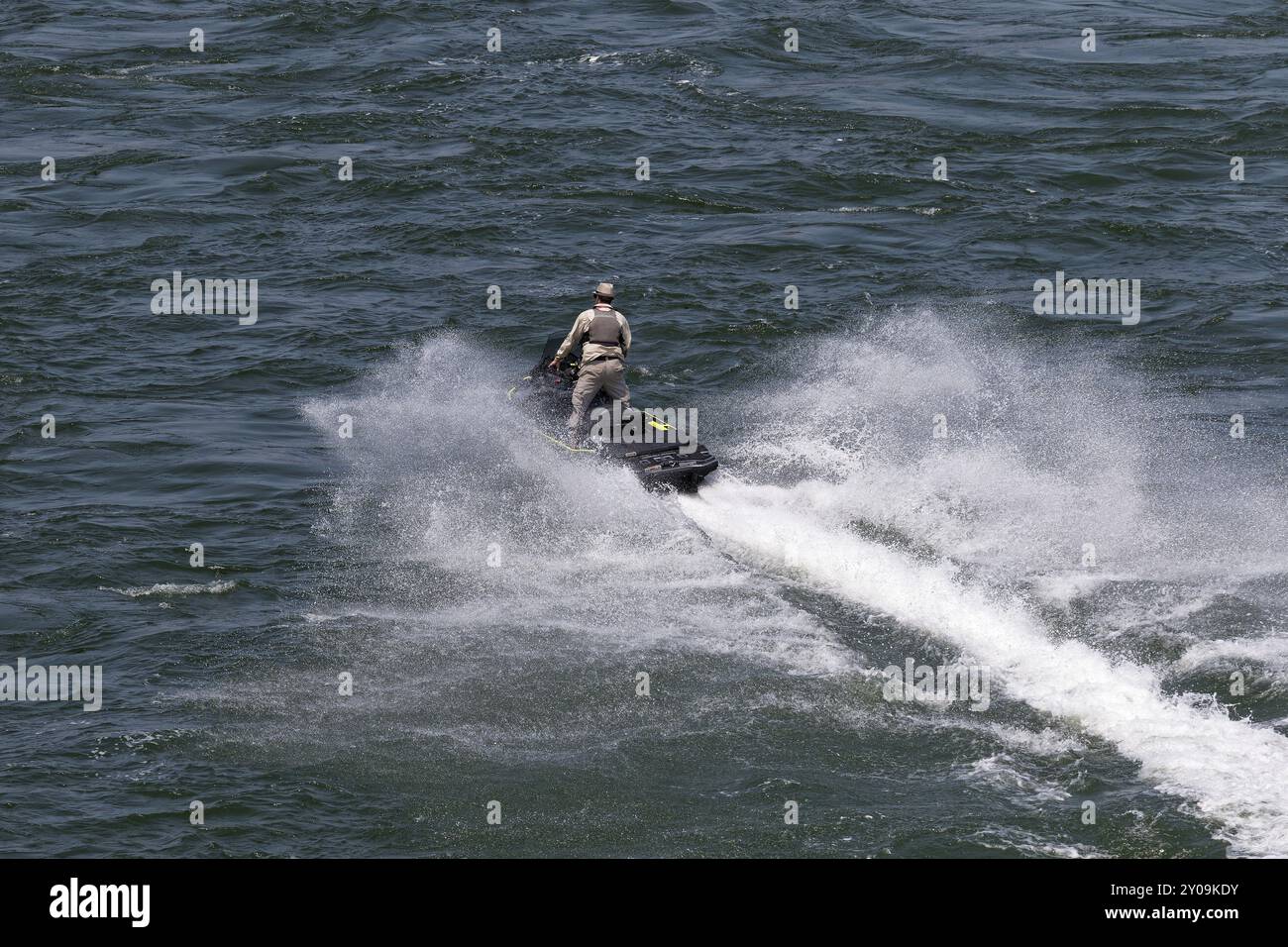 Amphibious water scooter, jetski riding on the Saint Lawrence River ...