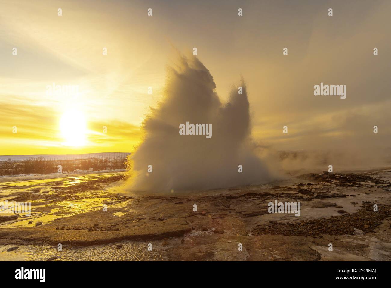 Beautiful eruption of the Strokkur Geyser at sunrise. Iceland's frozen ...