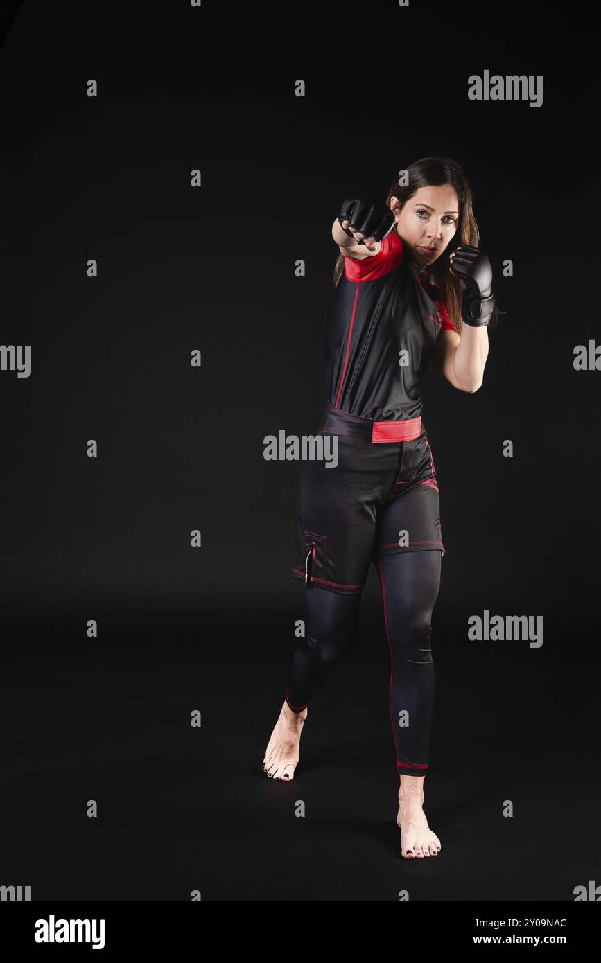 The Caucasian MMA fighter delivers a powerful blow, showcasing her ...