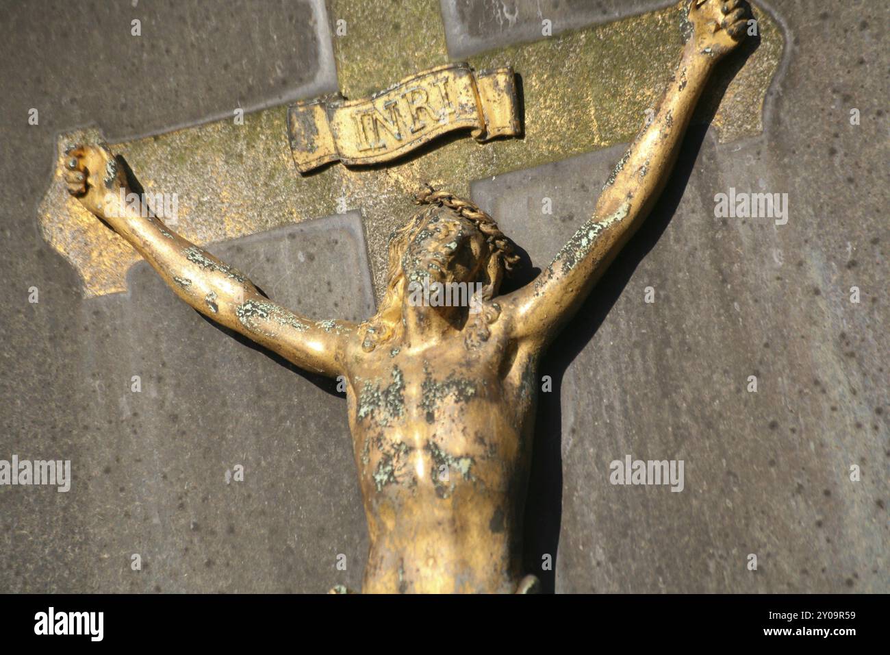 Crucified man on a gravestone Stock Photo - Alamy