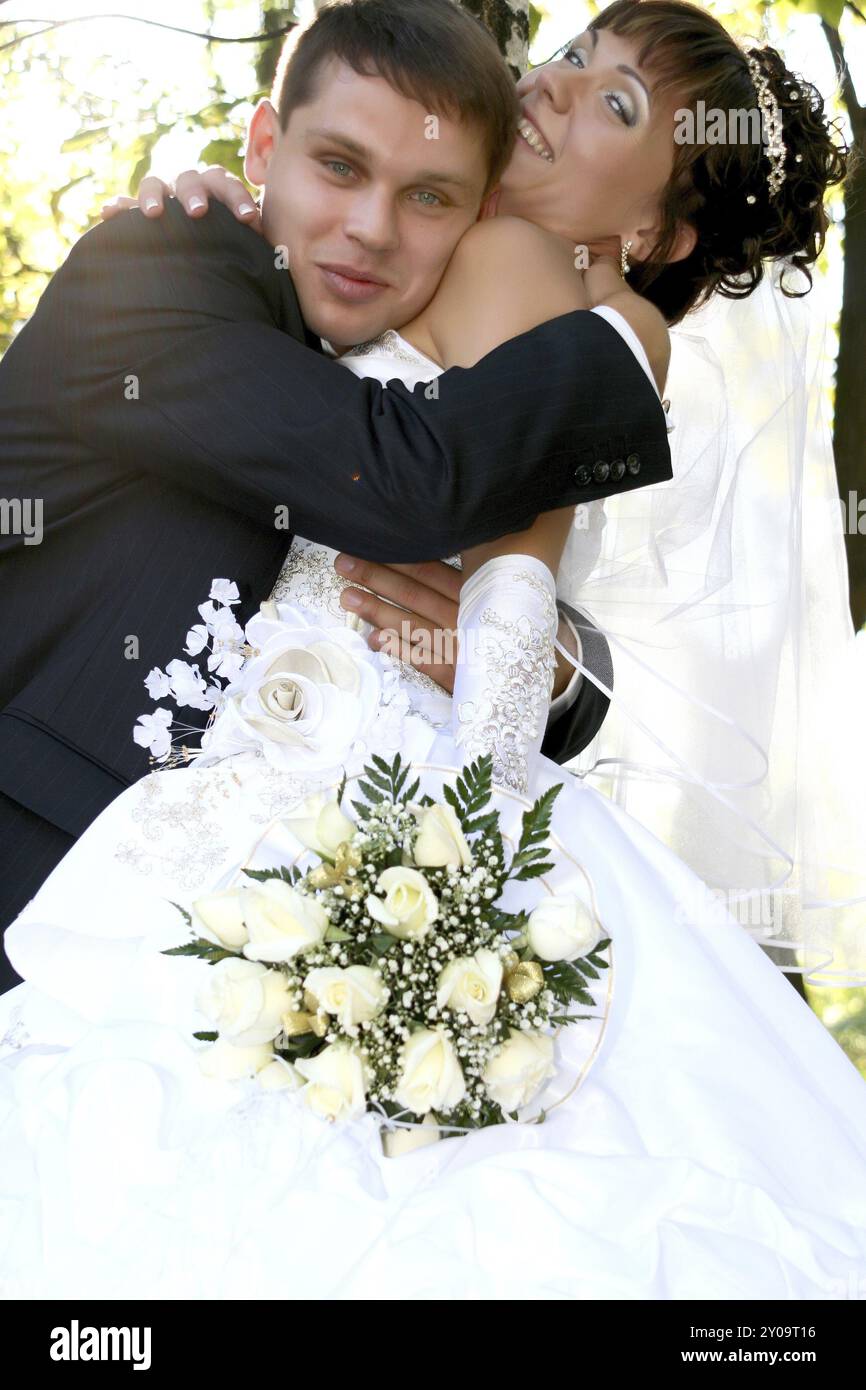 Newly married together in a photo pose Stock Photo - Alamy