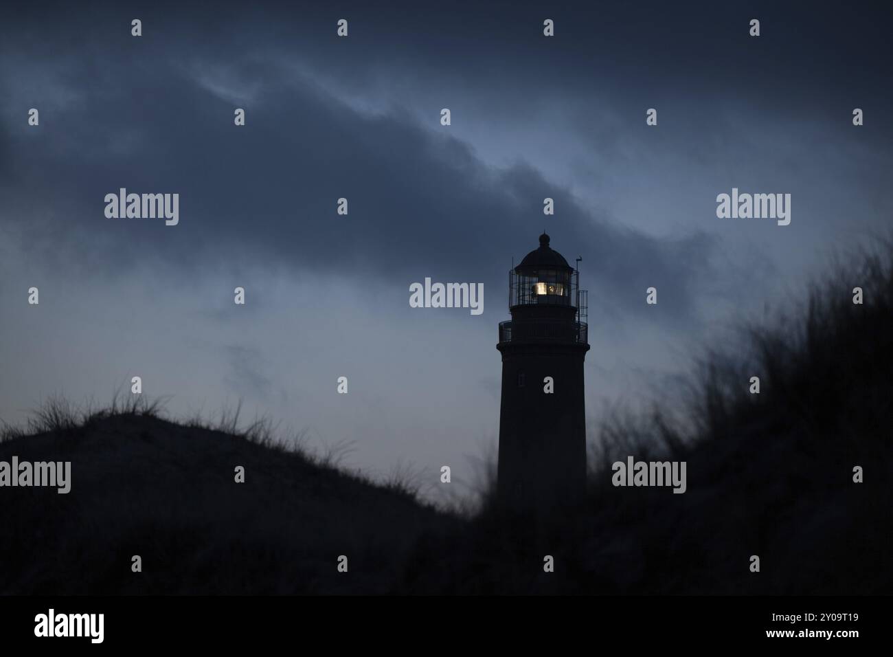 The light of a lighthouse shines in the darkness Stock Photo - Alamy