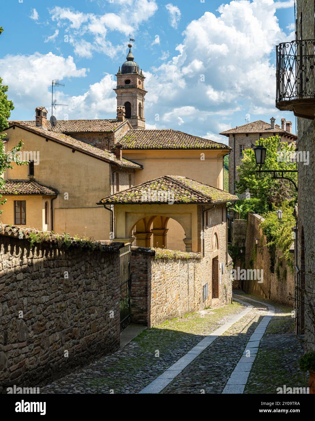 Stone pathway leading to a church in Castell'Arquato, a typical village ...