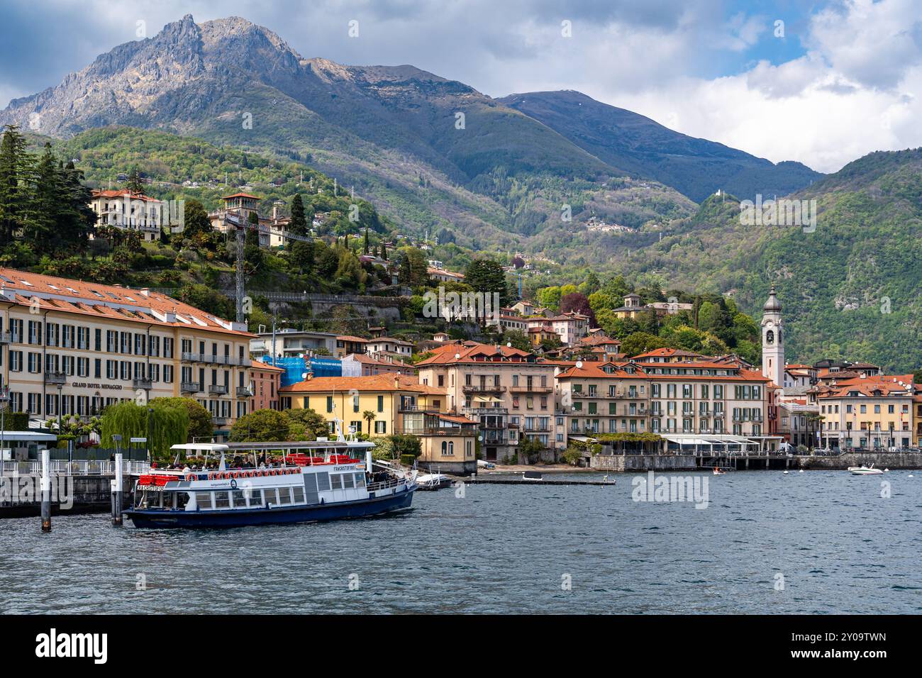 Menaggio, Italy, Apr. 24, 2024. A ferry boat docked in front of ...