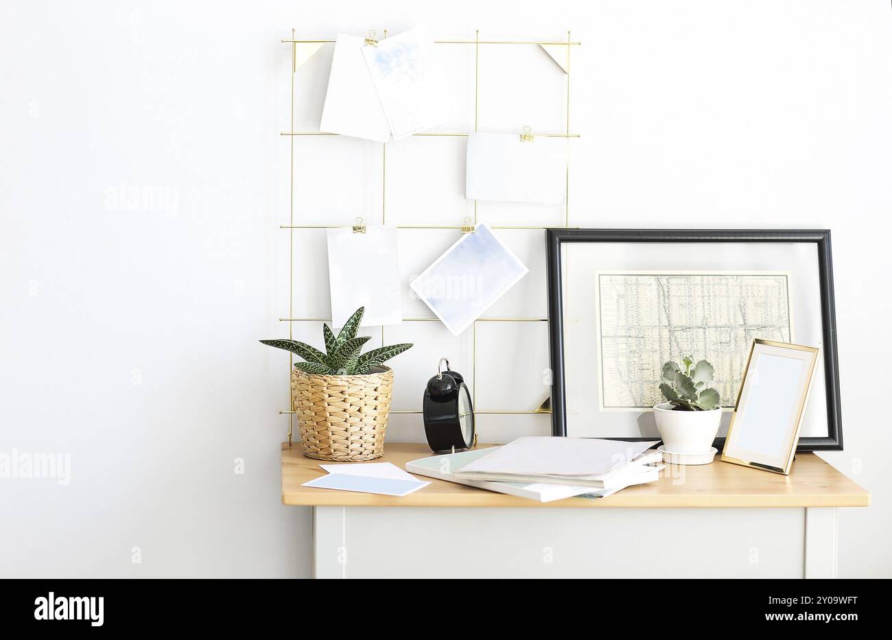 Designer working place at home with plants and moodboard Stock Photo ...