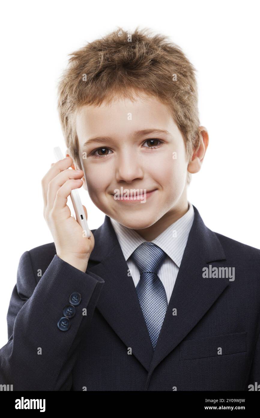 Little smiling child boy in business suit hand holding mobile phone or ...