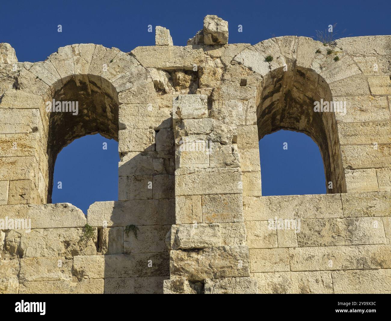Two stone arches stand against a clear blue sky, ancient ruins, athens, greece Stock Photo - Alamy