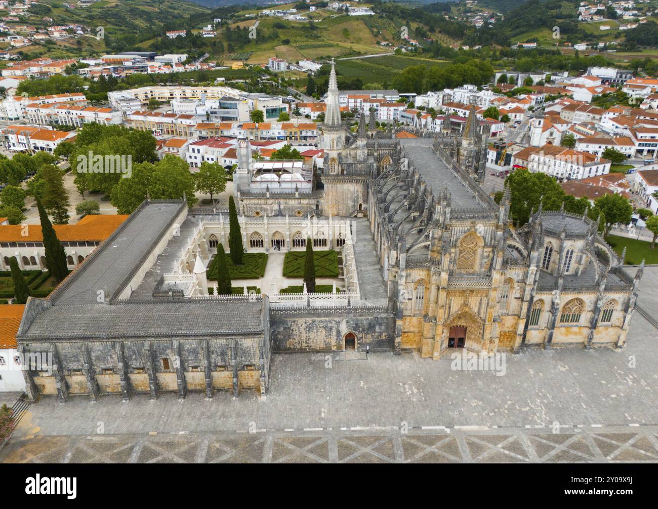 Aerial view of a Gothic monastery with a central courtyard surrounded ...