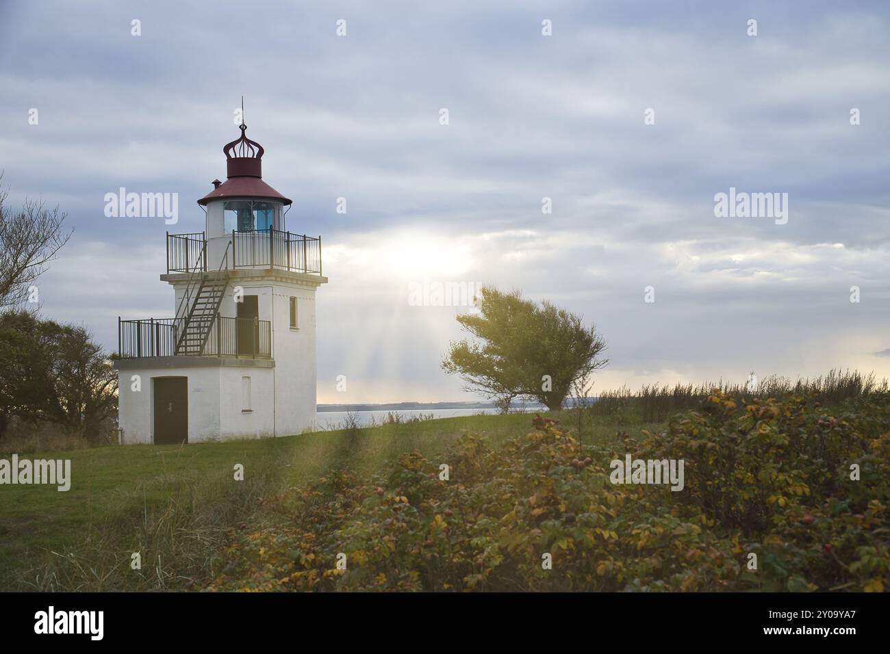 Lighthouse, Spodsbjerg Fyr in Huntsted on the coast of Denmark. Sun ...