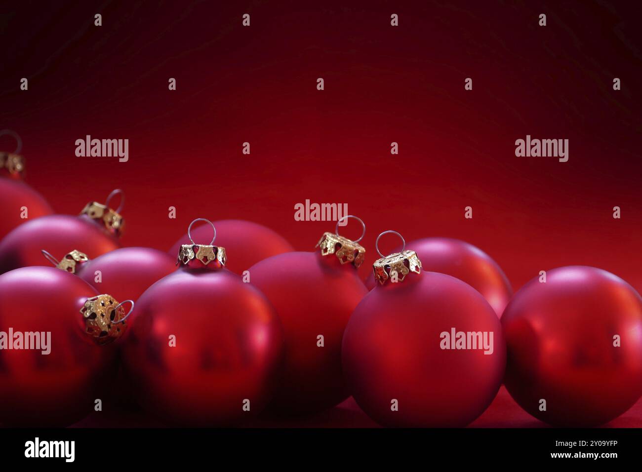 Christmas background, group of red christmas baubles with golden loops ...