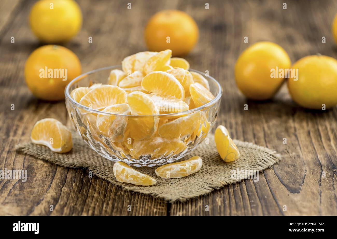Raw Tangerine pieces (close-up shot) on vintage background Stock Photo ...