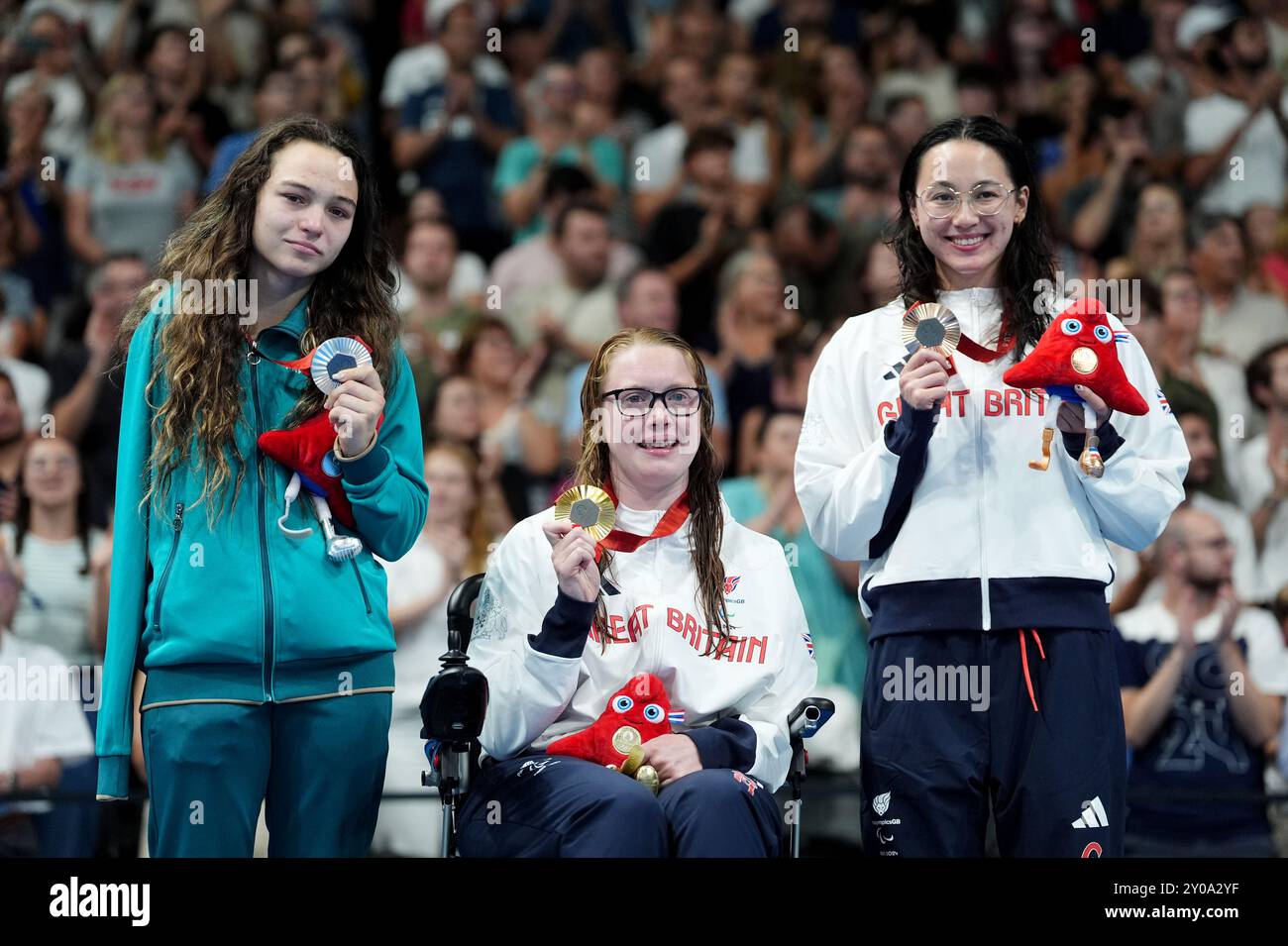 Great Britain's Brock Whiston (centre) and Great Britain's Alice Tai ...
