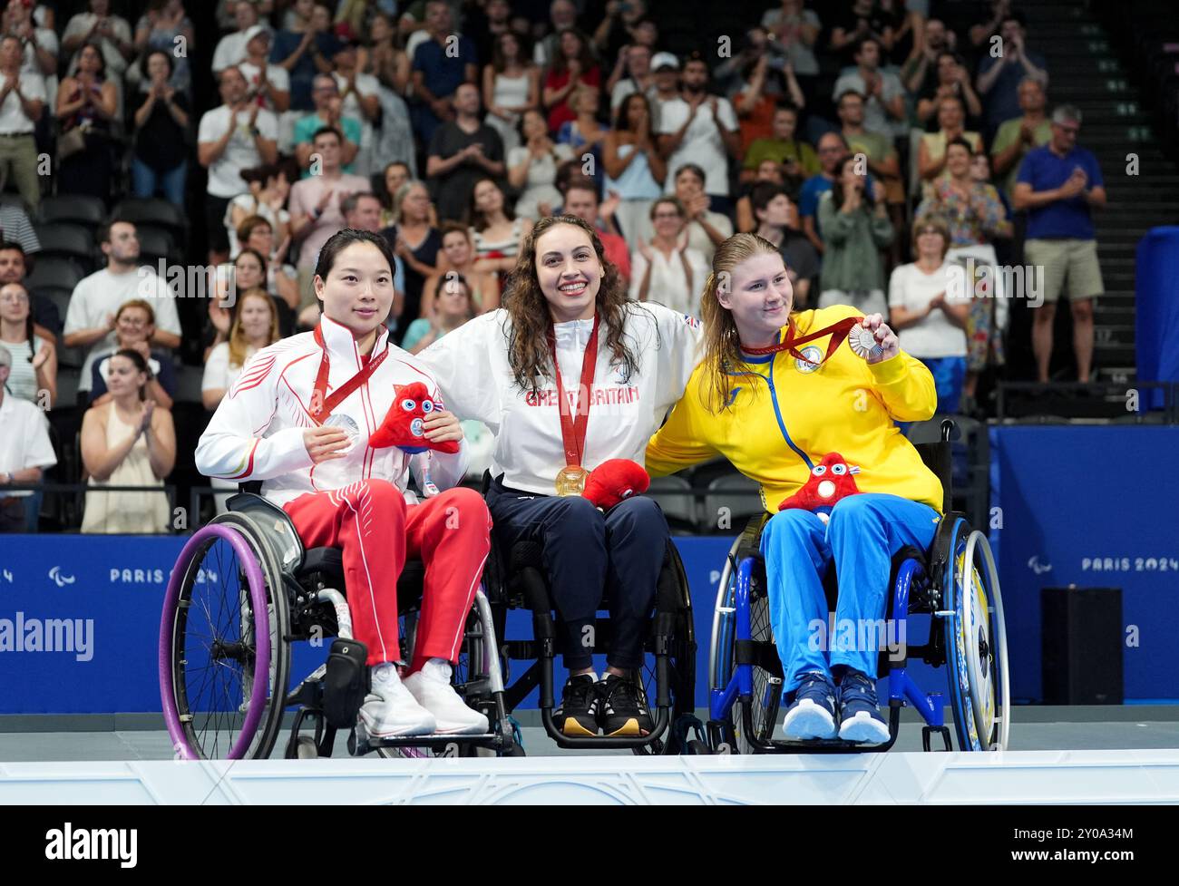 Great Britain's Grace Harvey (centre) celebrates with her gold medal ...