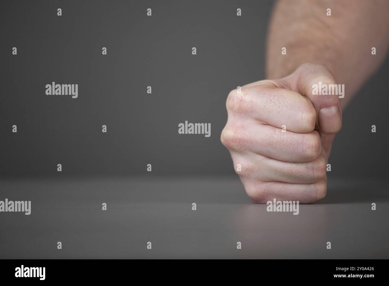 Male fist on table hi-res stock photography and images - Alamy