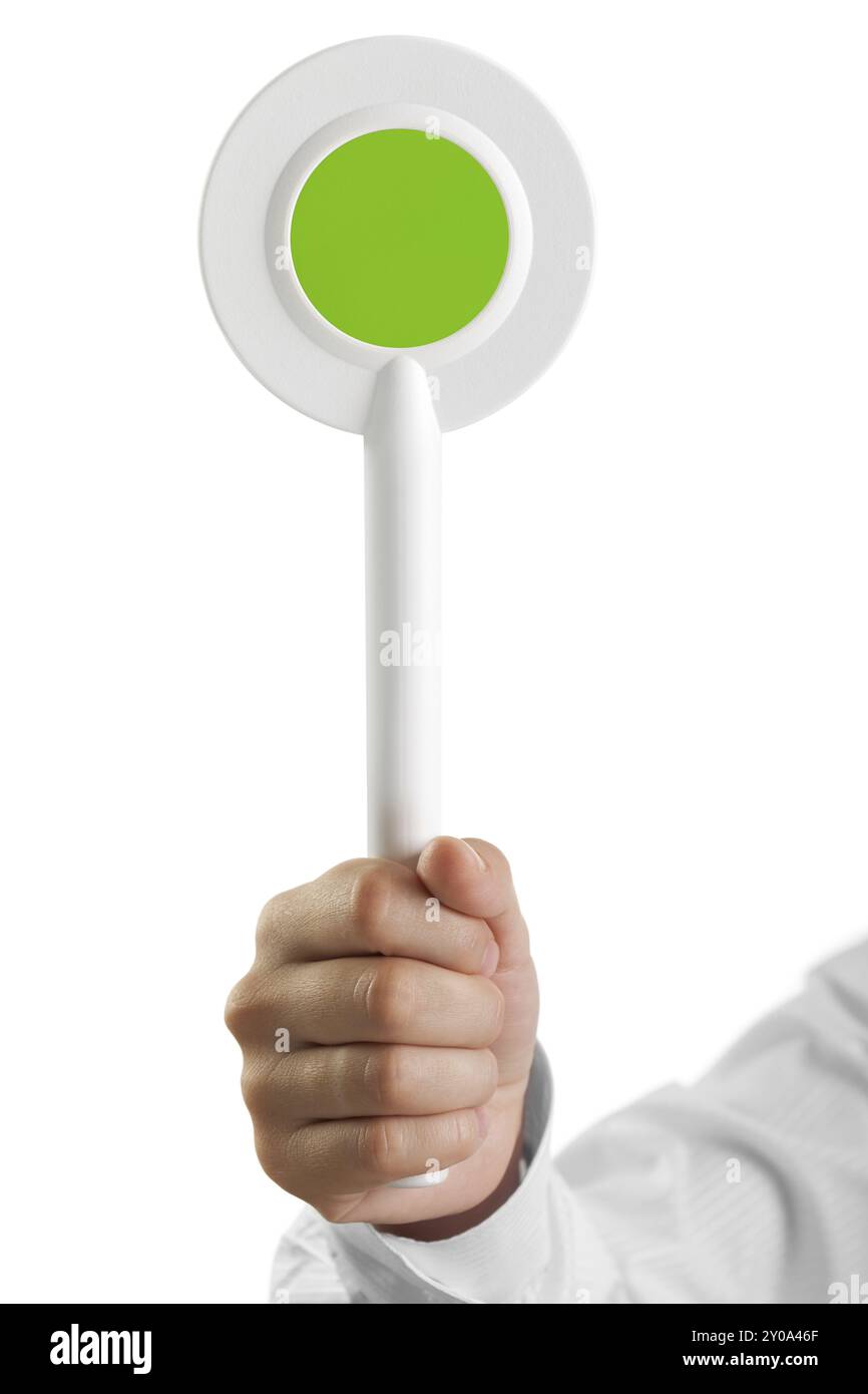 Human hand holding auction paddle voting card sign Stock Photo - Alamy