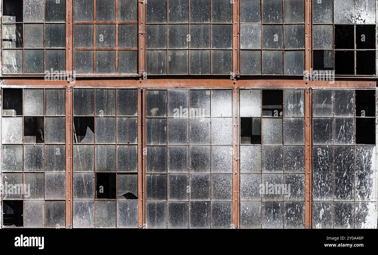 Old cracked building wall with dirty broken windows glass texture ...
