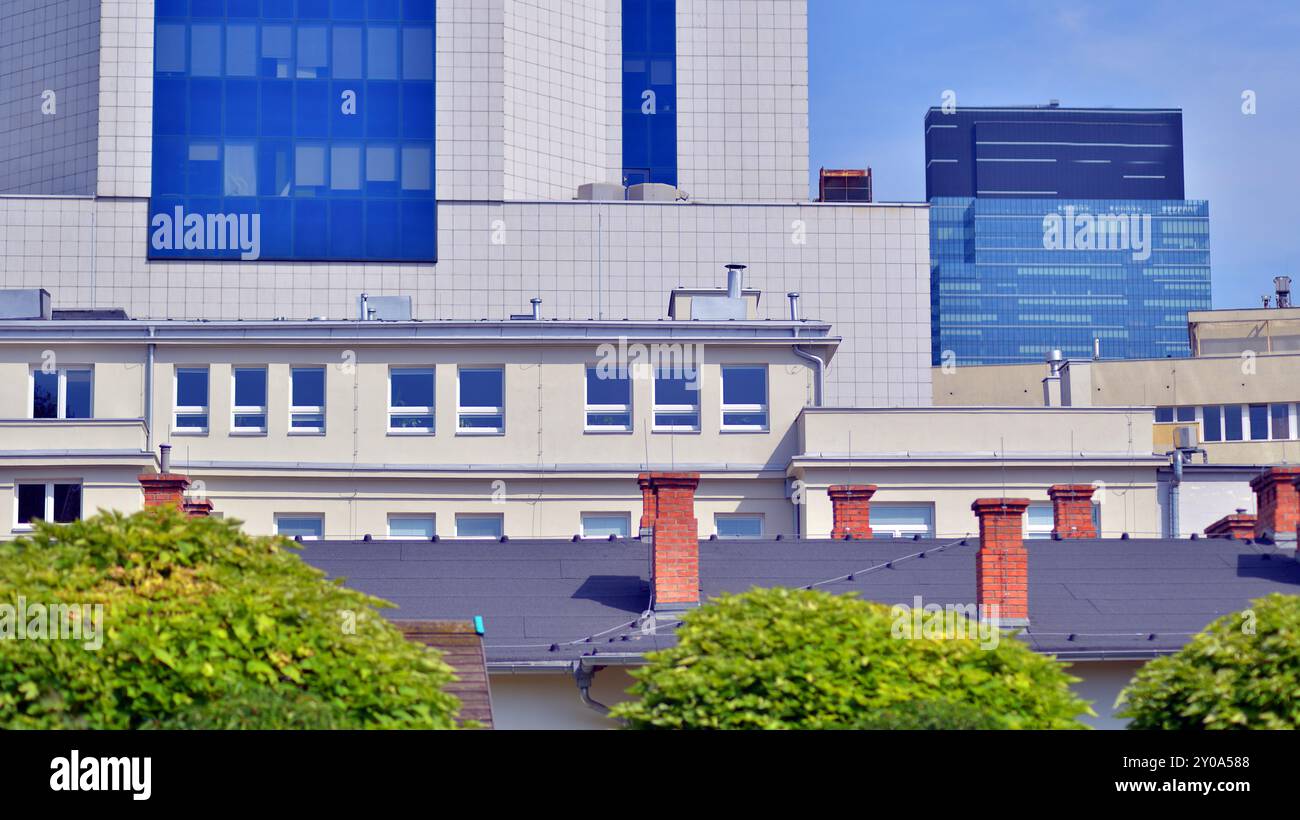 Contrast of old and new buildings in downtown . An ancient building ...