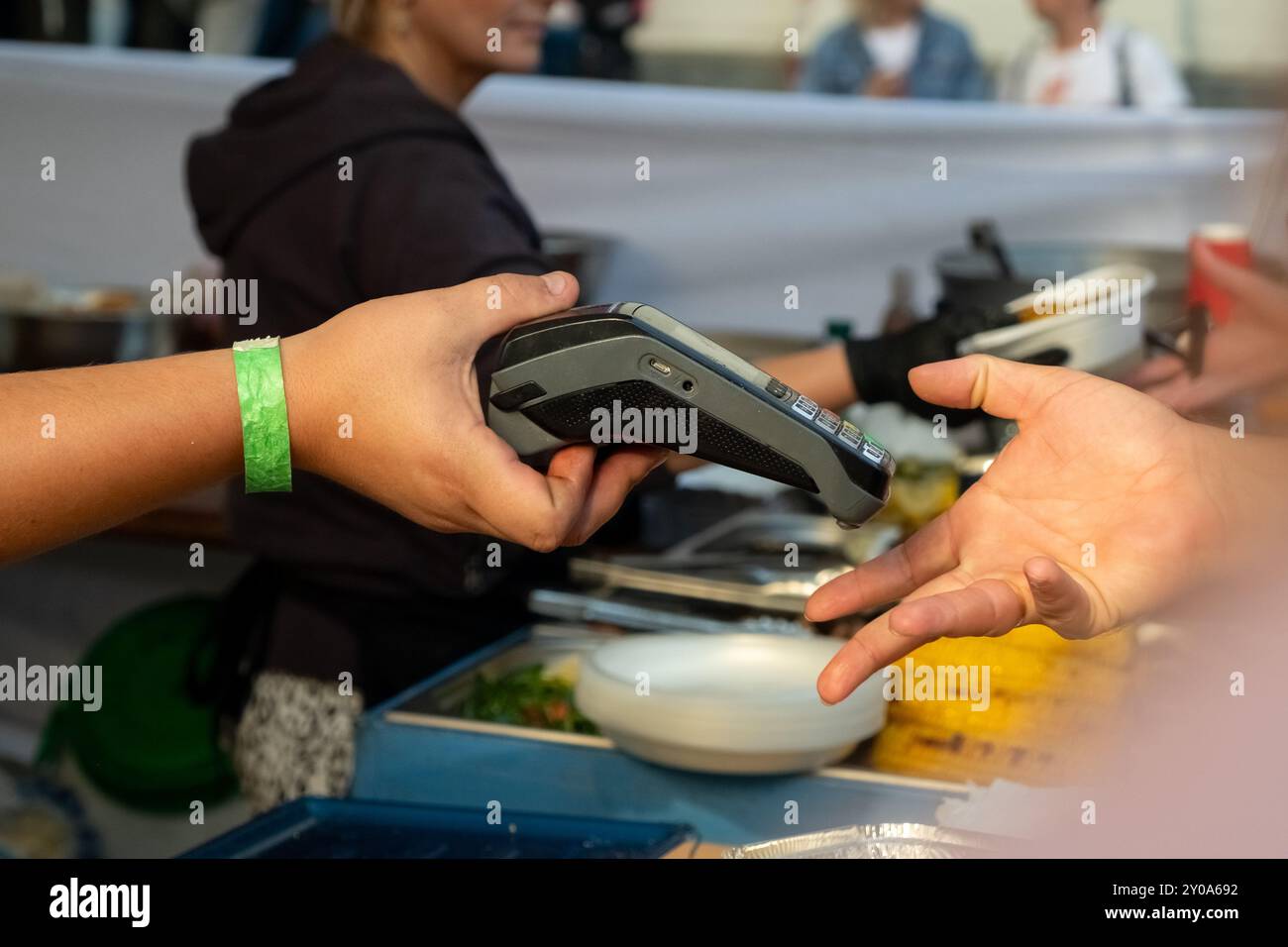 Contactless Payment at Outdoor Food Stall. Blurred Stock Photo - Alamy