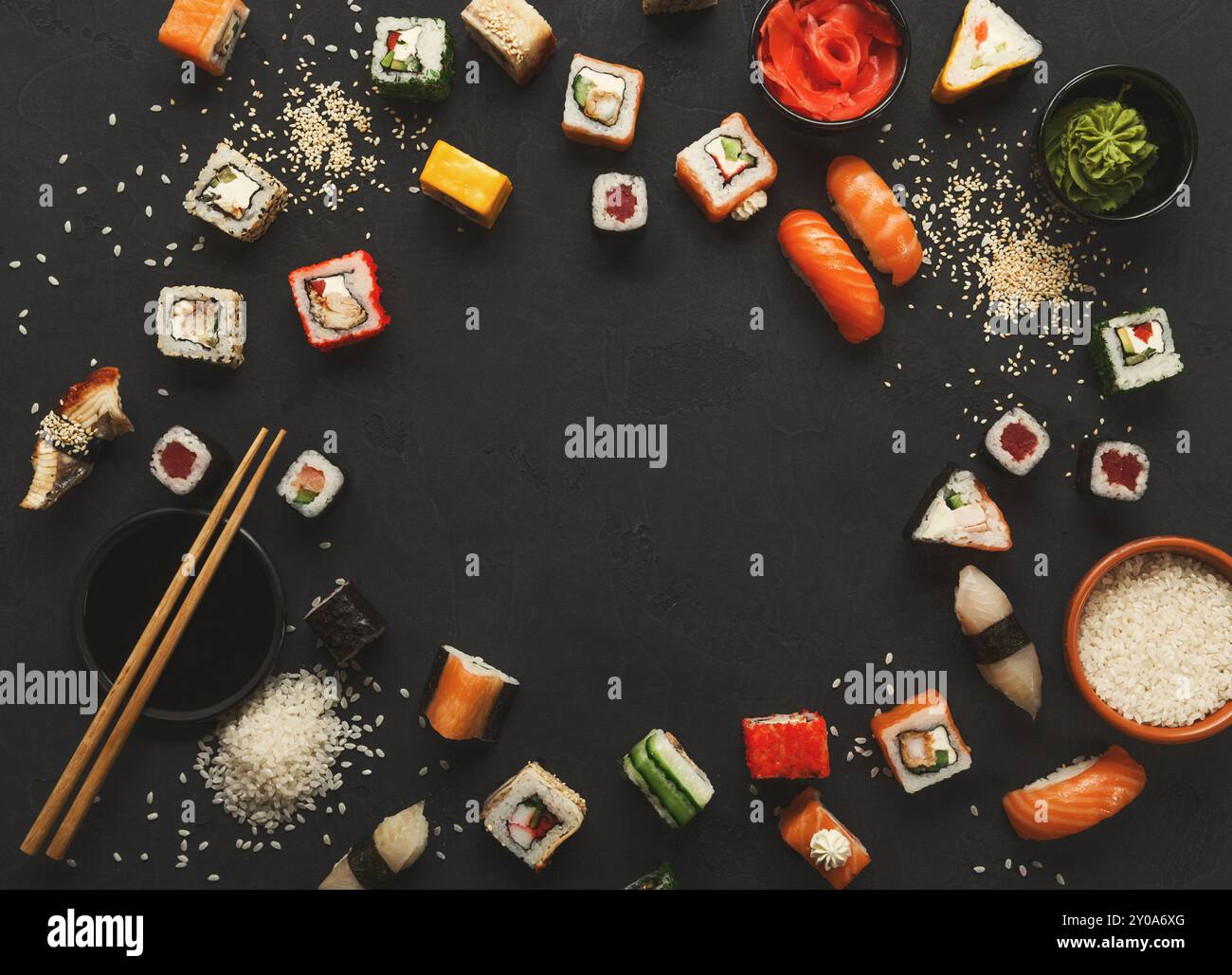 Sushi and rolls background, frame on black, top view Stock Photo - Alamy