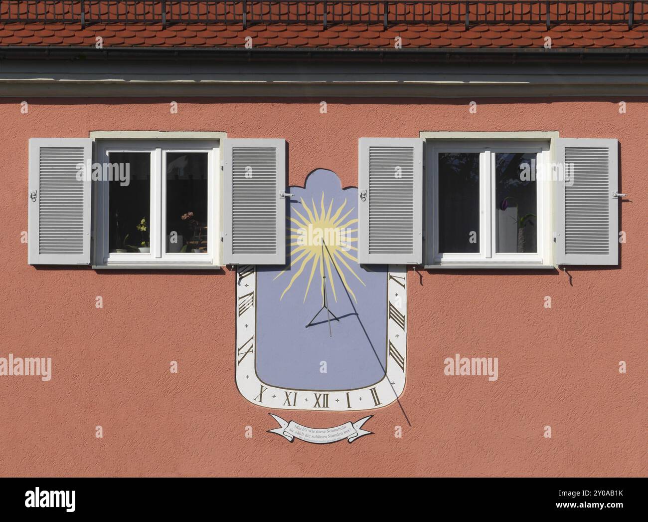 Facade with window and sundial Stock Photo - Alamy