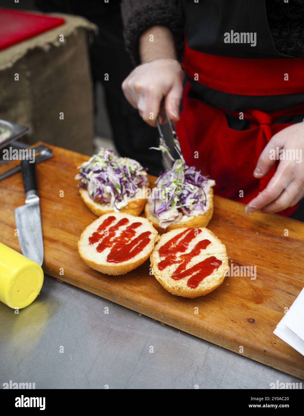 Chef making beef burgers outdoor on open kitchen food festival event ...
