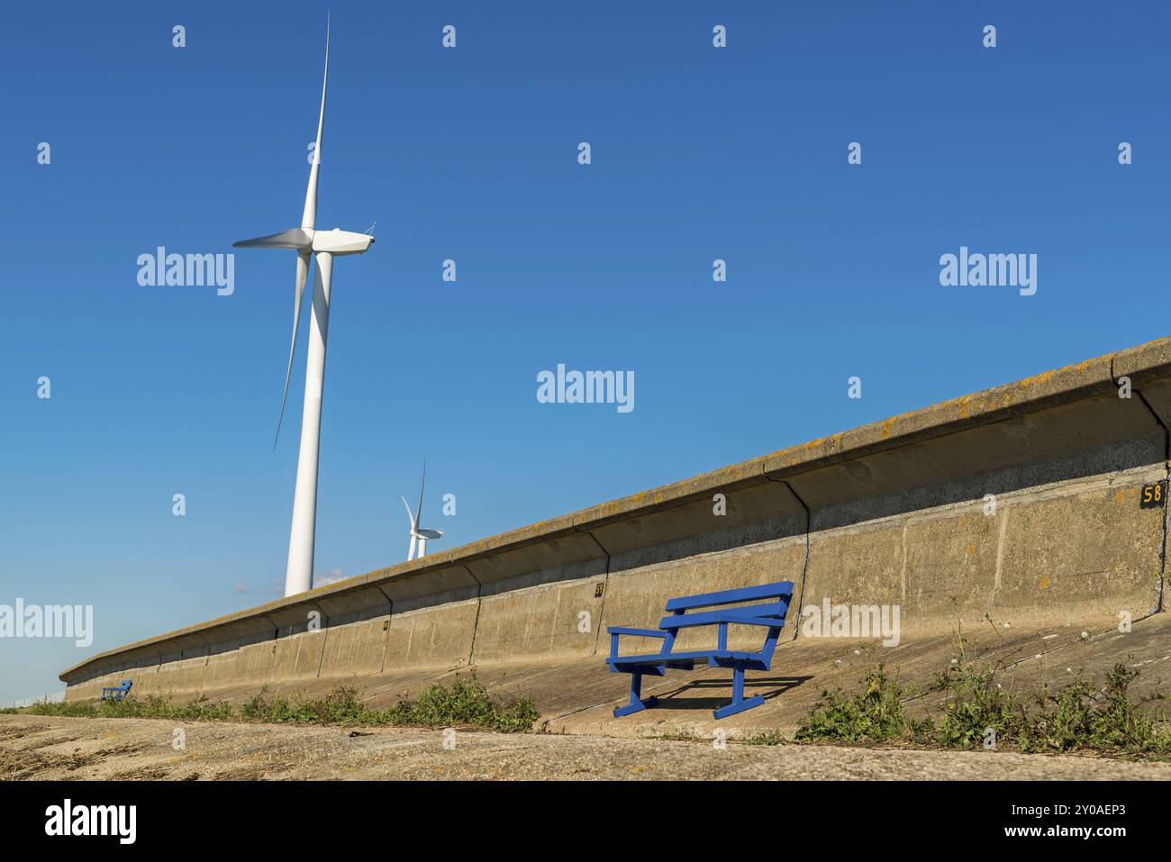 A bench and wind turbines in Queenborough, Isle of Sheppey, Kent ...